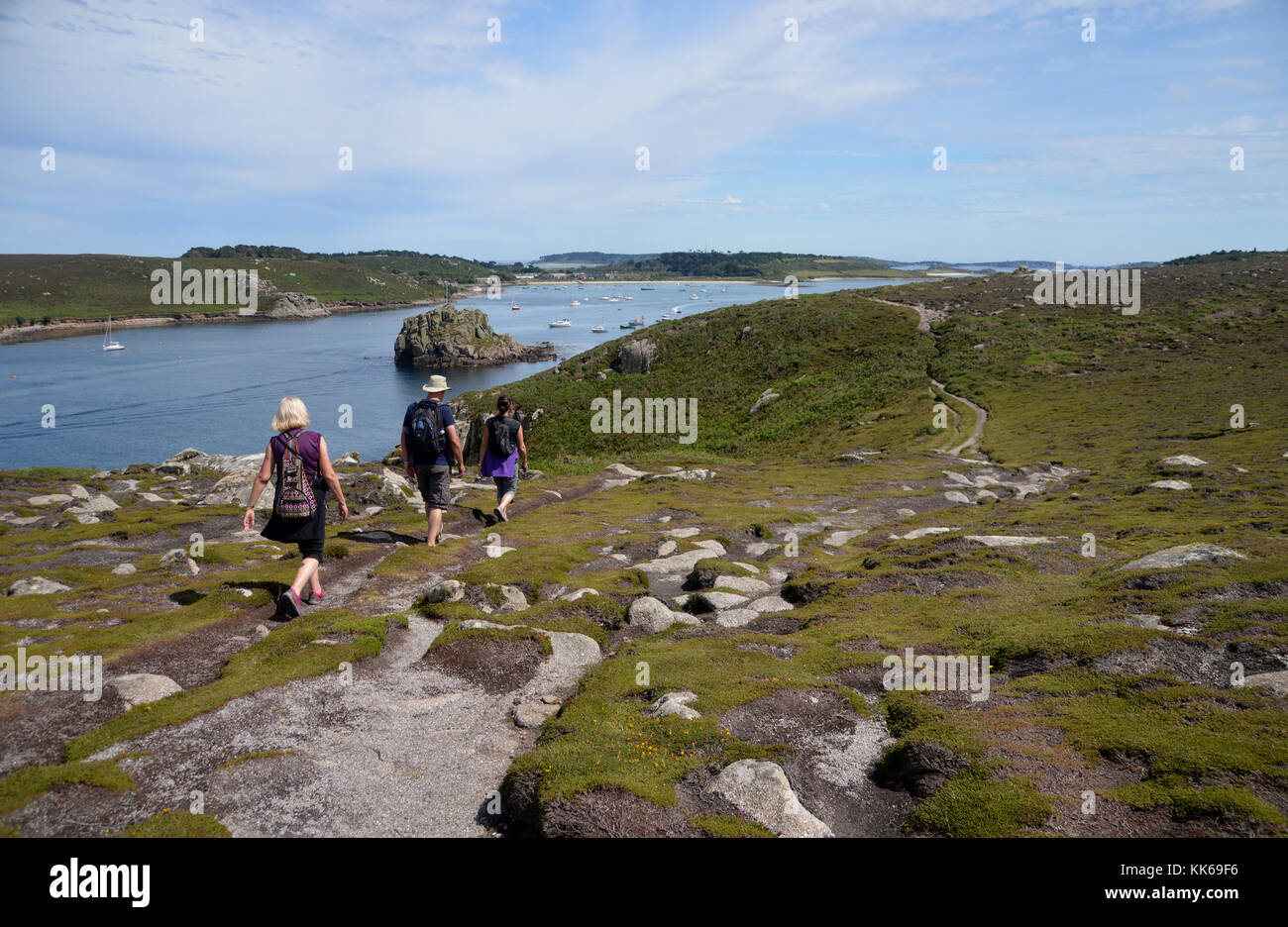 Three Hikers on the Coastal Path on Bryher Island Looking over to New ...