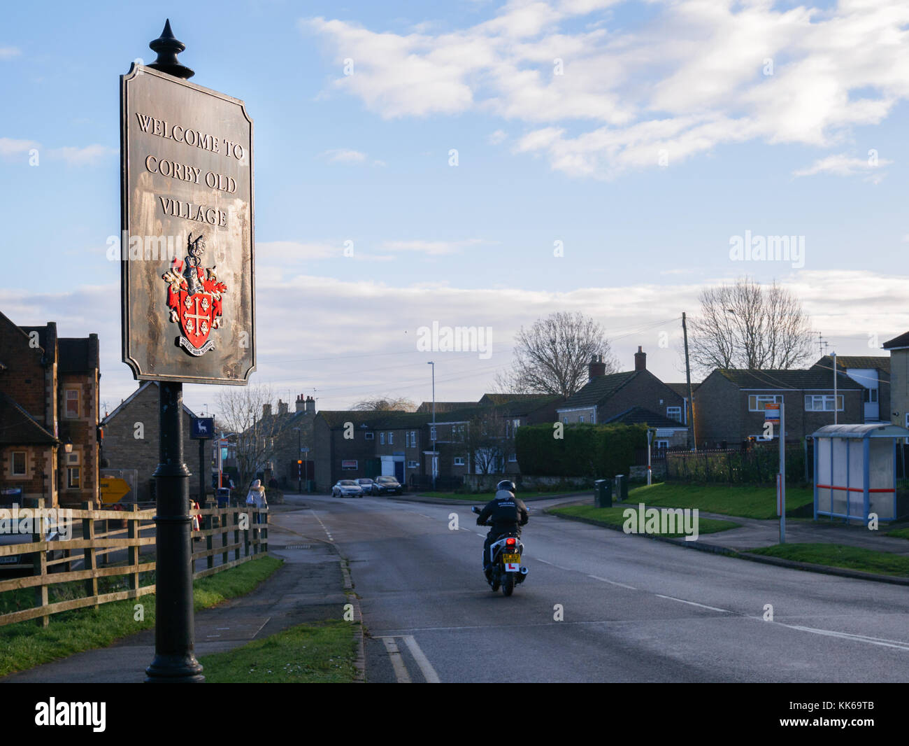 The High street, leading to the centre of the old village at Corby ...