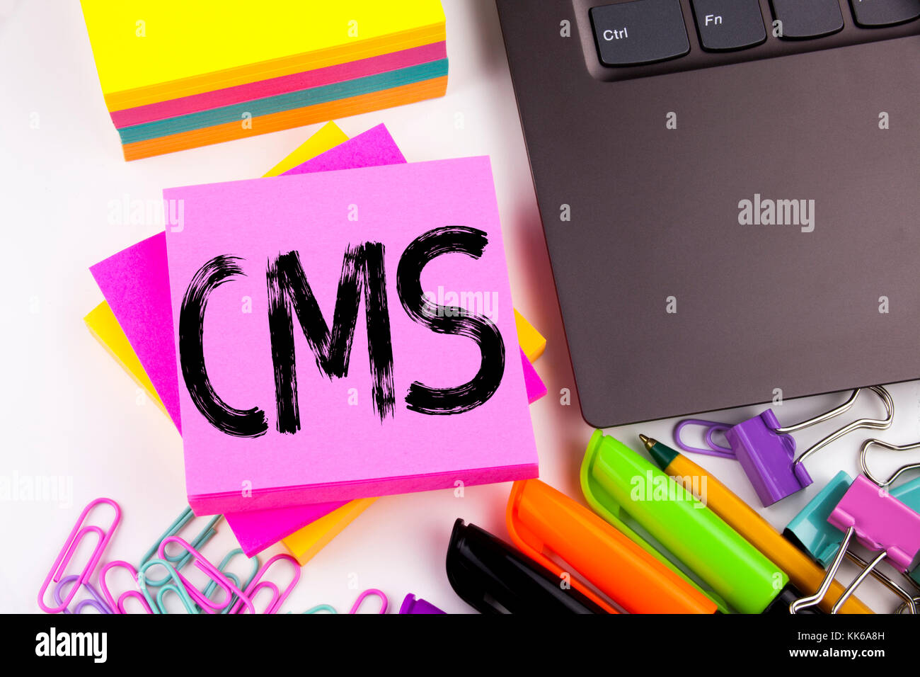 Writing text showing CMS made in the office with surroundings such as ...