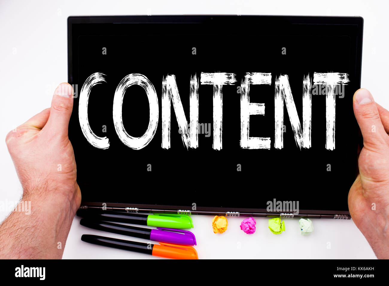Content text written on tablet, computer in the office with marker, pen ...