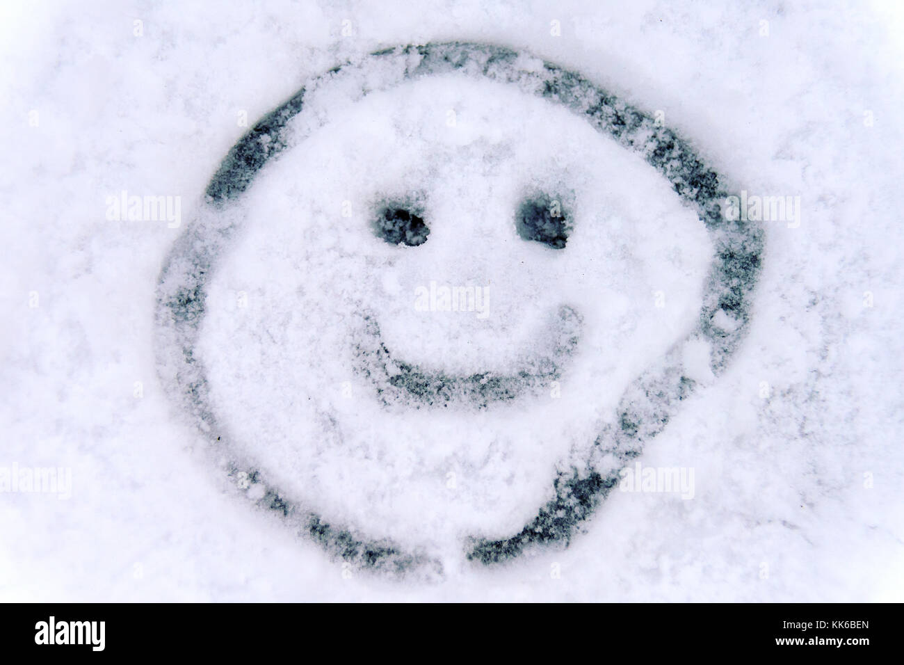 cheerful winter smiley on white, cold and loose snow Stock Photo - Alamy