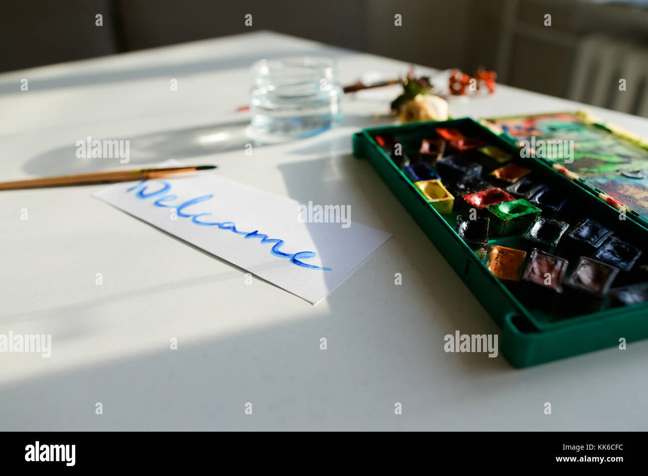 Calligraphic text Welcome, written in colors on white paper, whi Stock ...