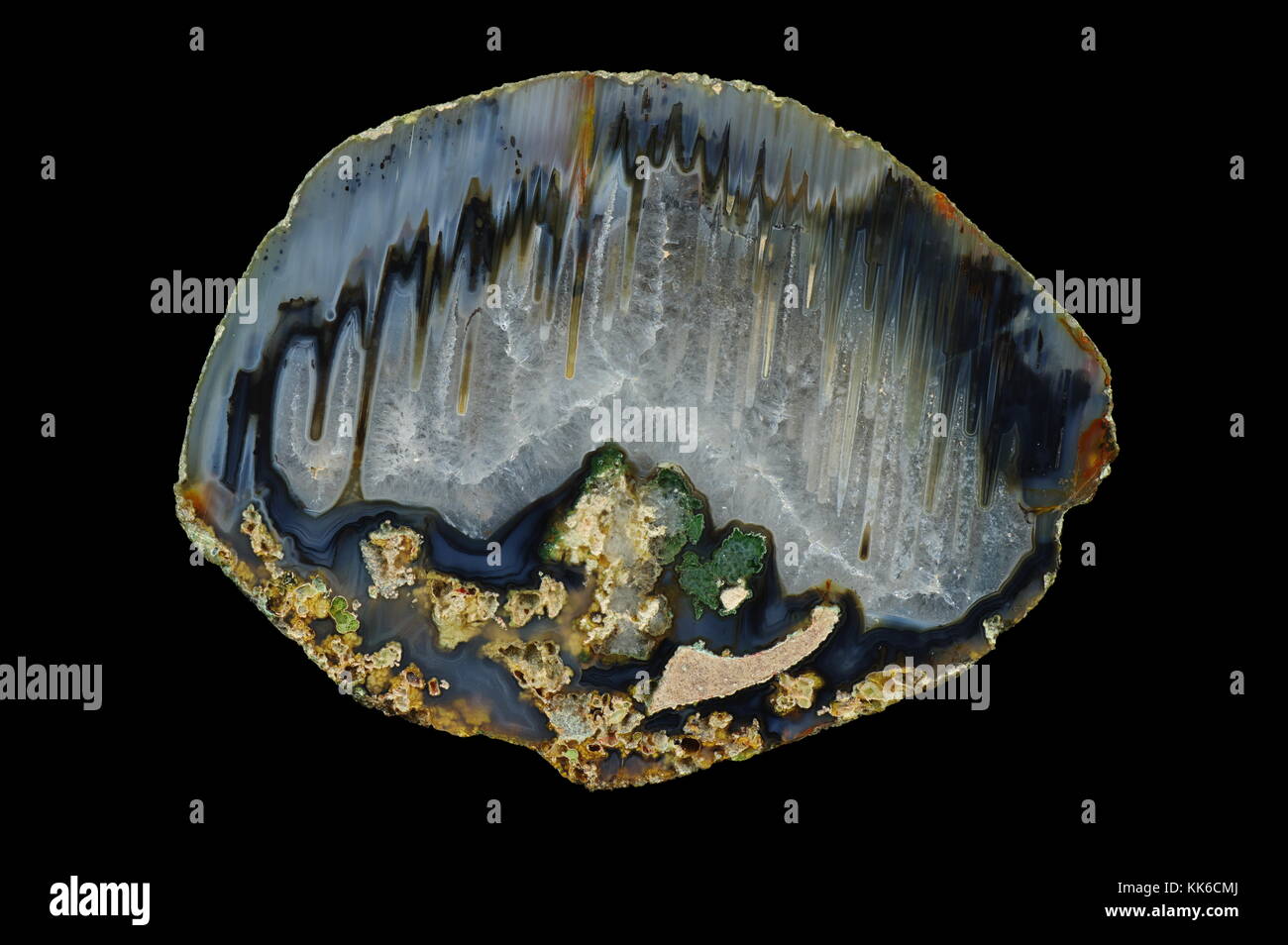 A cross section of the agate stone. Multicolored silica bands colored ...