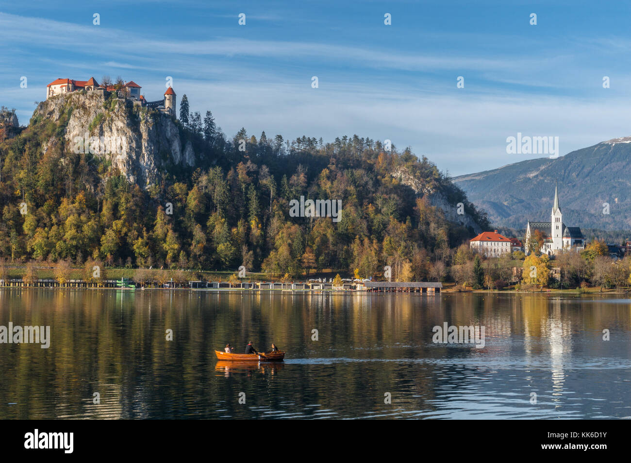 Tourists in row boat taking in the sights at lake Bled Stock Photo - Alamy