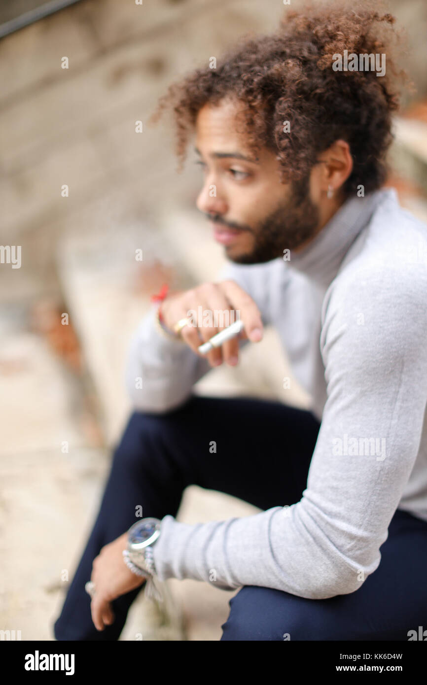 Close up face male person smoking on steps Stock Photo - Alamy