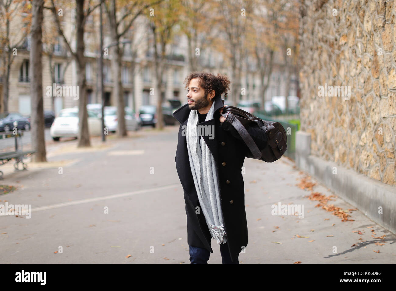 Sad mix blood man going to railway station and looking at watch Stock ...