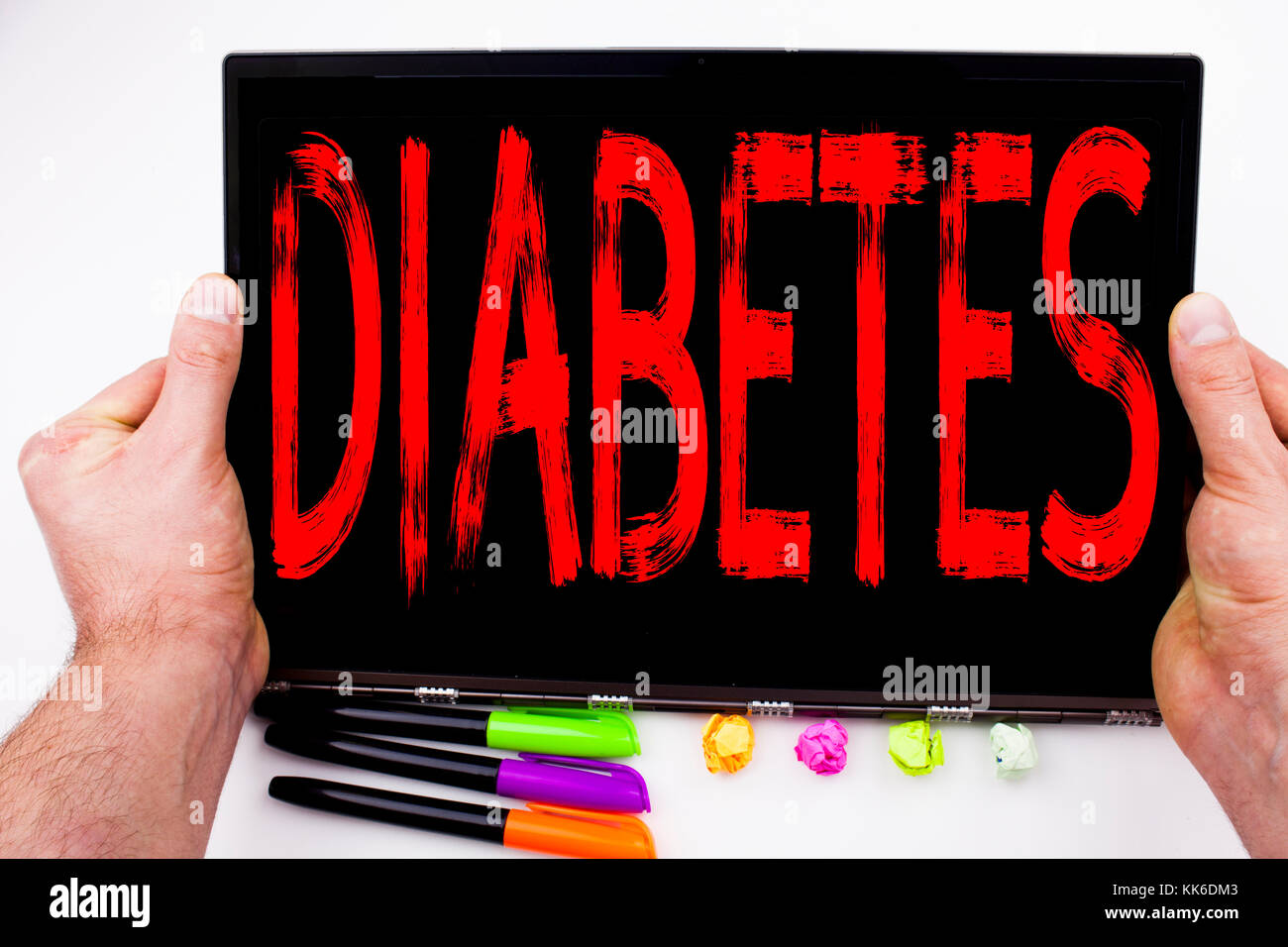 Diabetes text written on tablet, computer in the office with marker ...