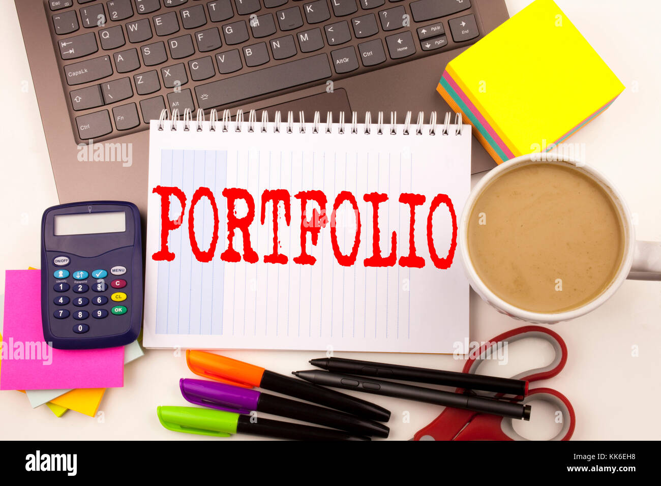 Word writing Portfolio in the office with laptop, marker, pen ...