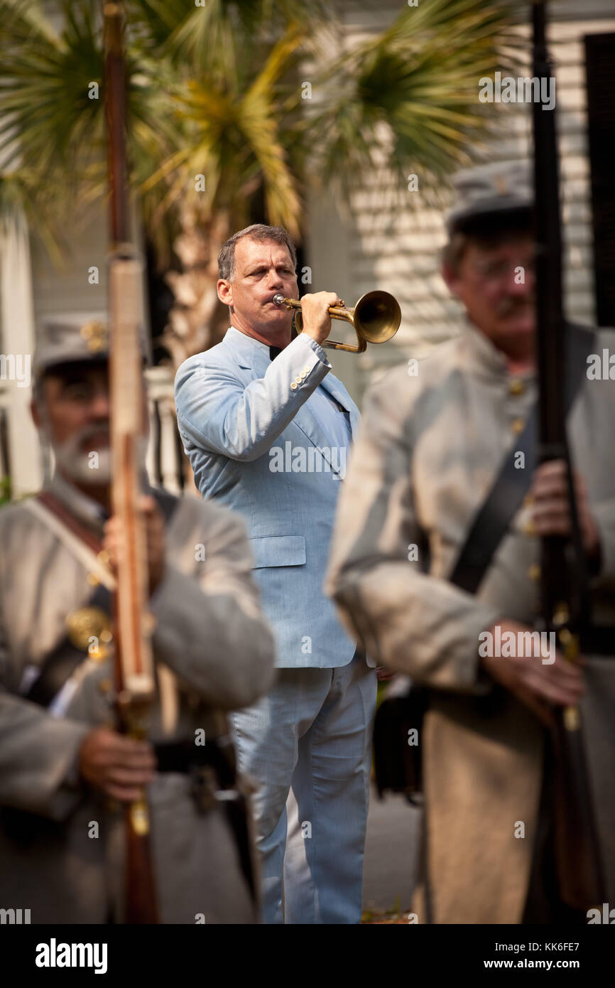 Confederate re-enactors stand for taps at the Confederate Cemetery to ...