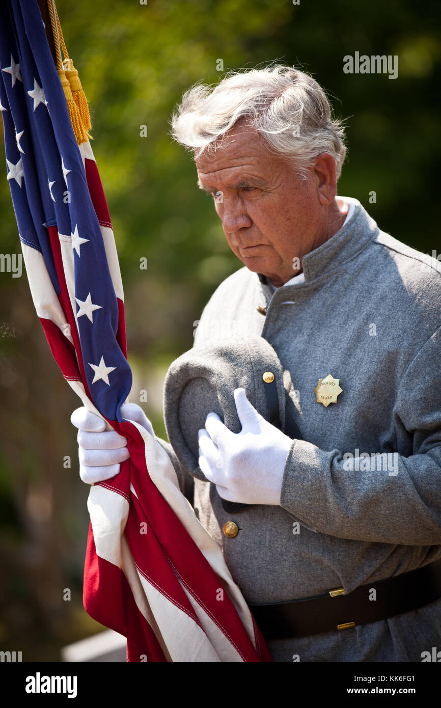 A Confederate Civil War re-enactor stands for a moment at Magnolia ...