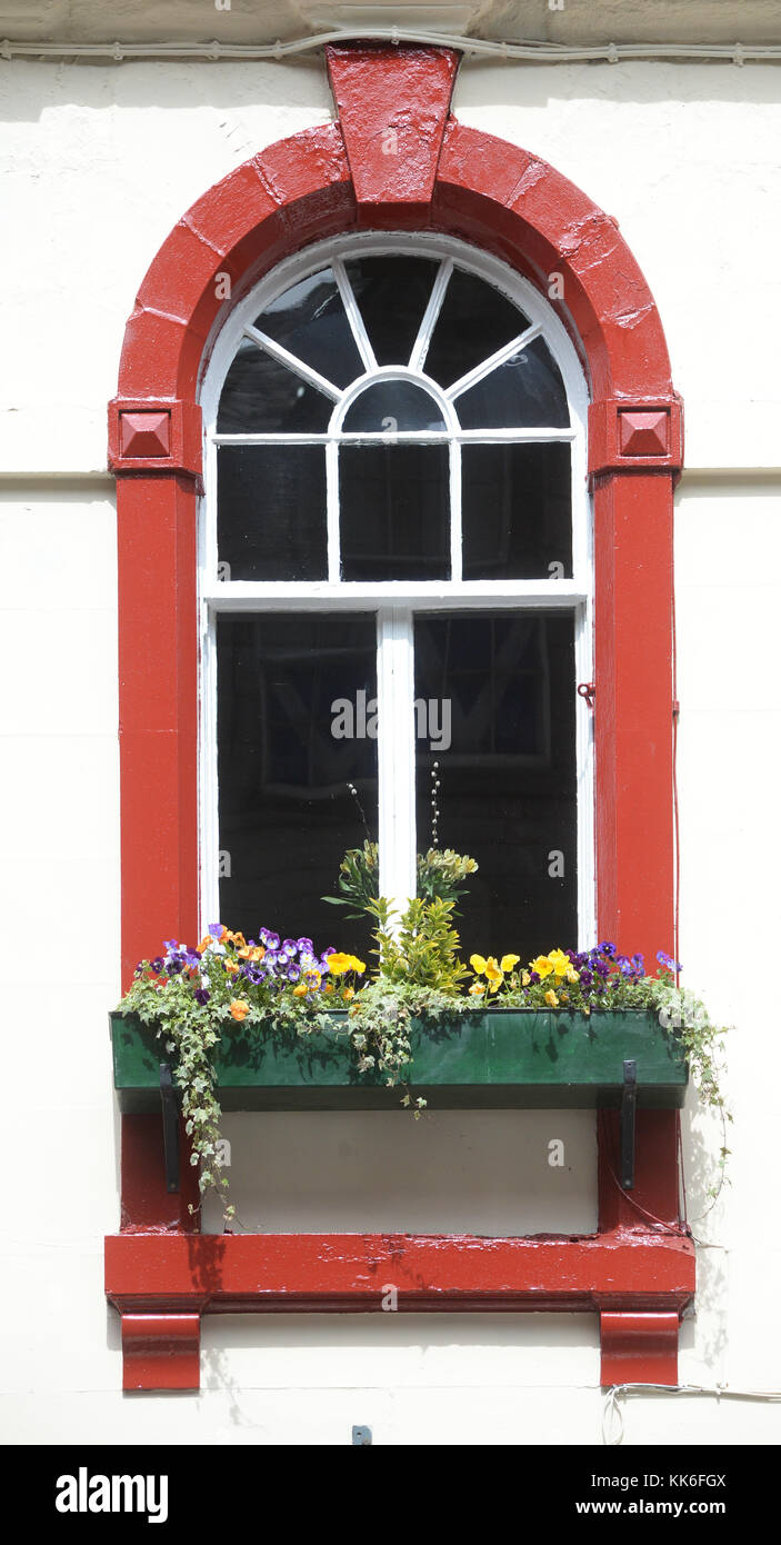 An arched window with flower box Stock Photo - Alamy