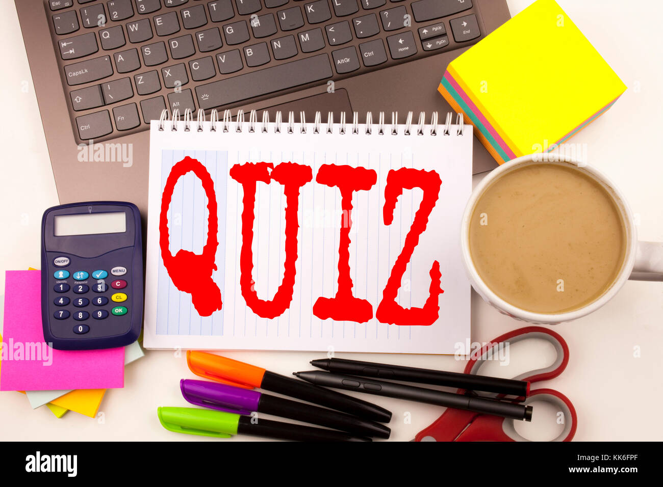 Word writing Quiz in the office with laptop, marker, pen, stationery ...