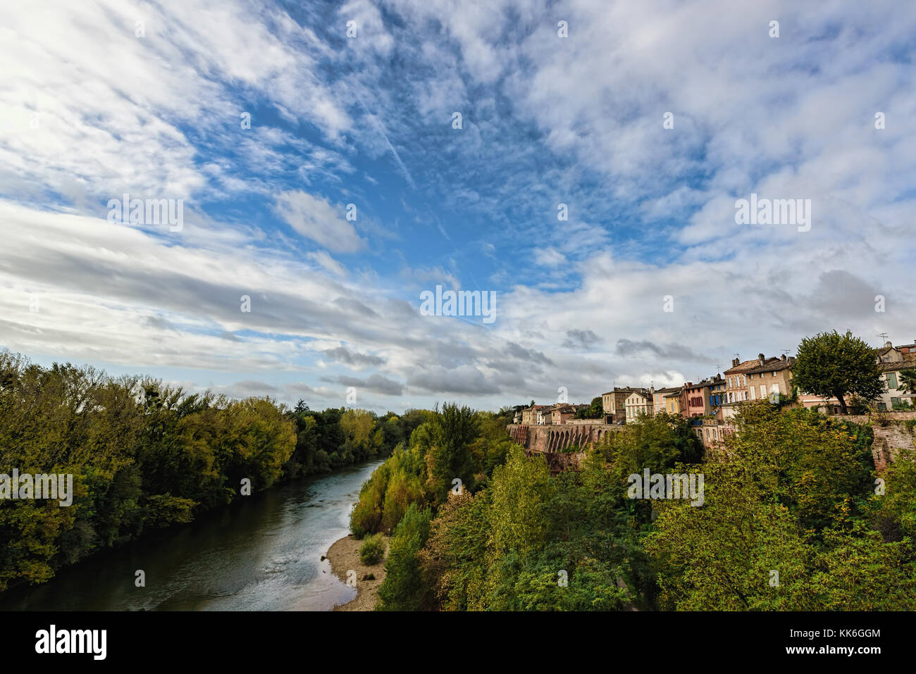 Looking down from the bridge the river with beautiful reflections of ...