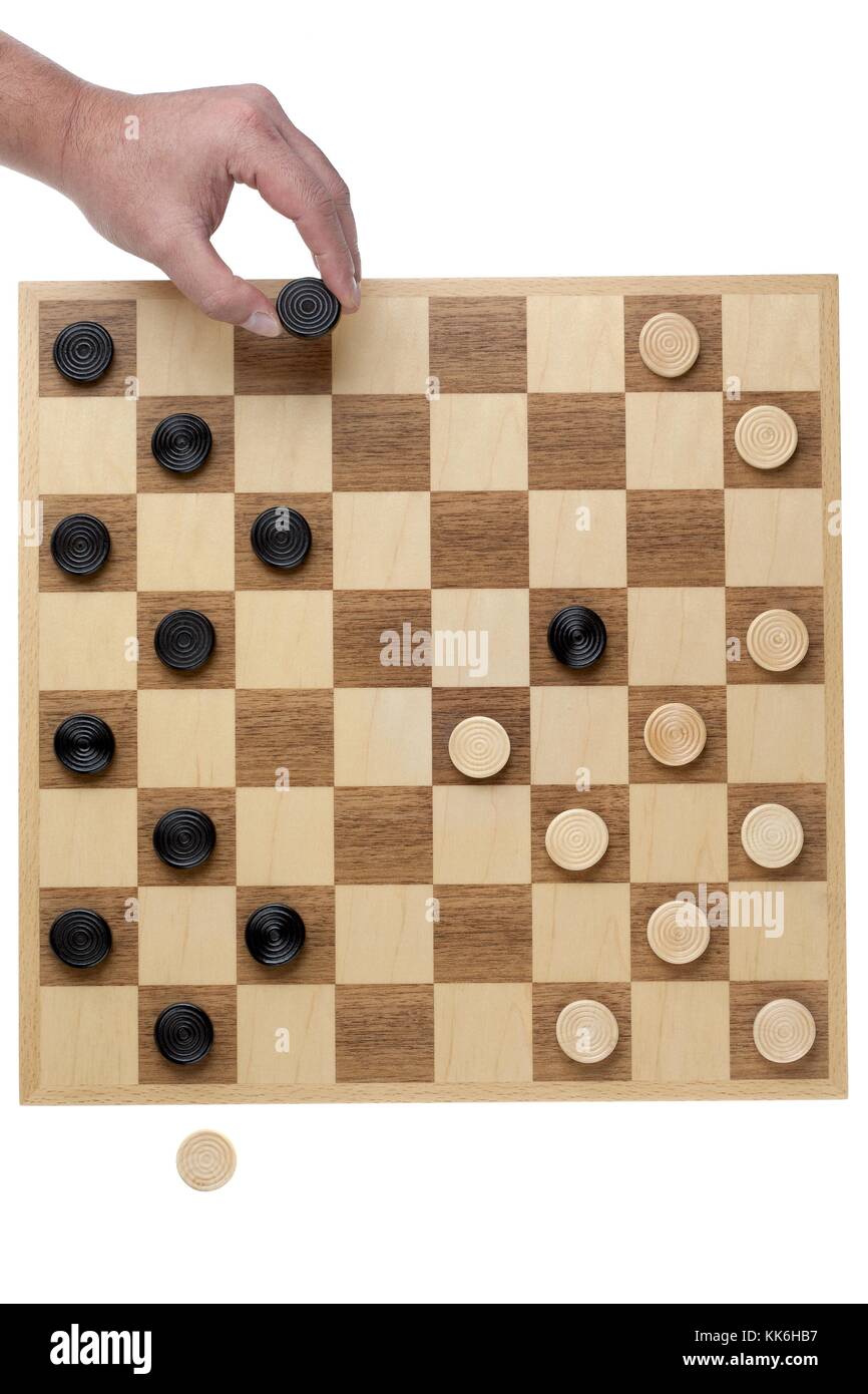 dark checker piece on the moves on the game board Stock Photo - Alamy