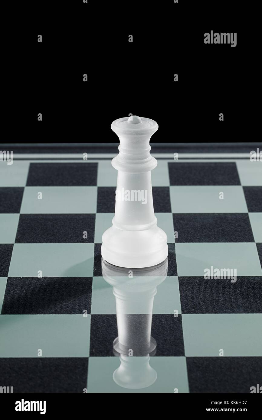 glass chess queen standing on chess board Stock Photo - Alamy