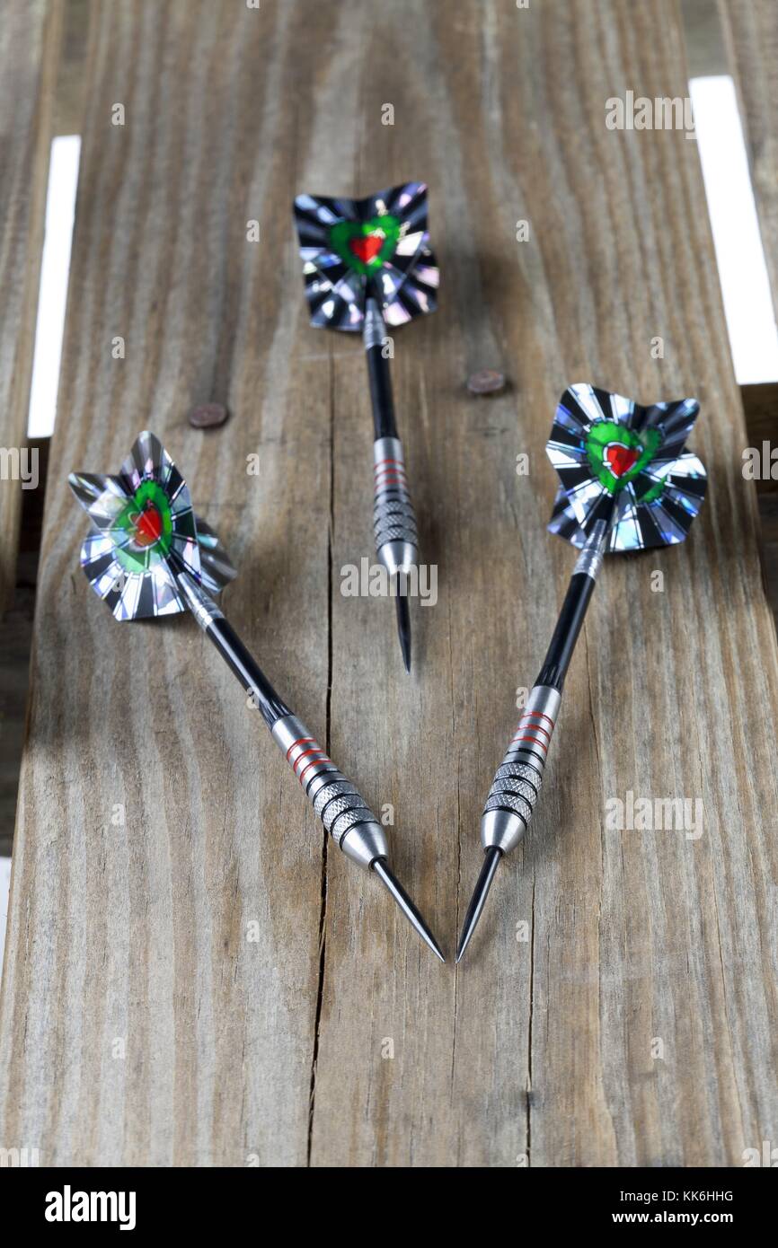 three sharp dart pins Stock Photo - Alamy