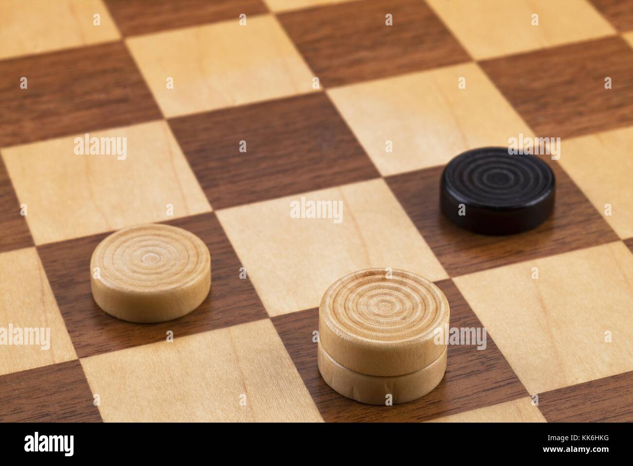 checker pieces on board Stock Photo - Alamy