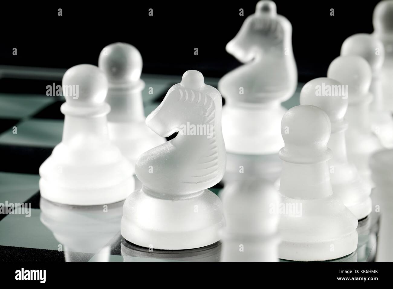 chess pawn and chess knight on board Stock Photo - Alamy