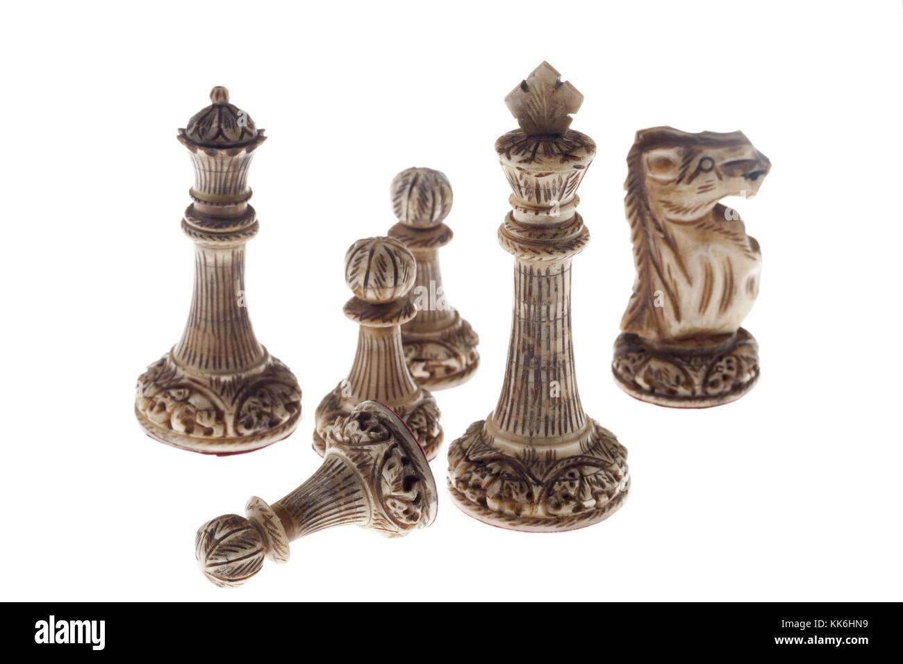 chess pieces with a fallen pawn chess piece on white Stock Photo - Alamy
