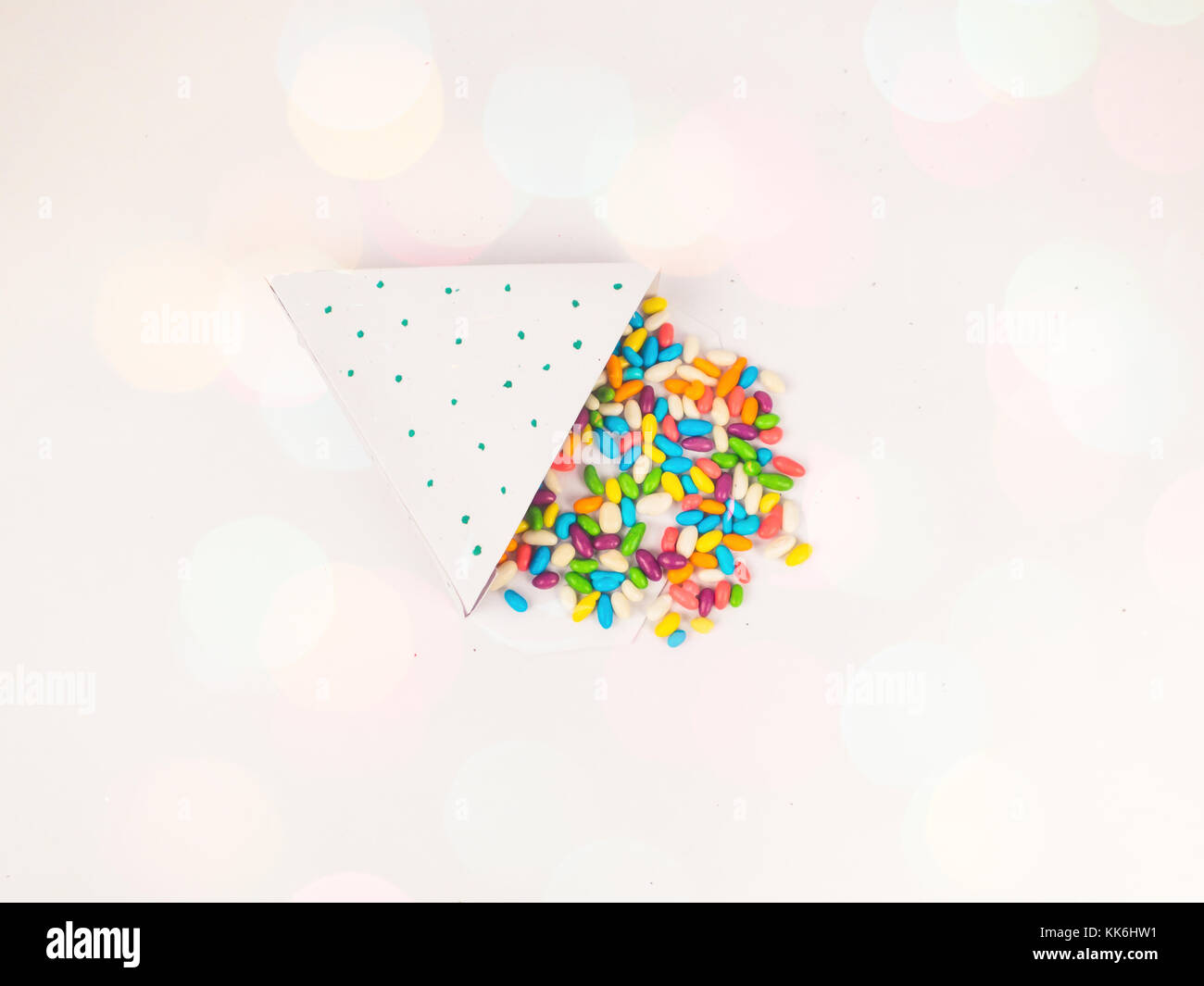 Christmas decoration triangle gift box with colorful candies from the ...