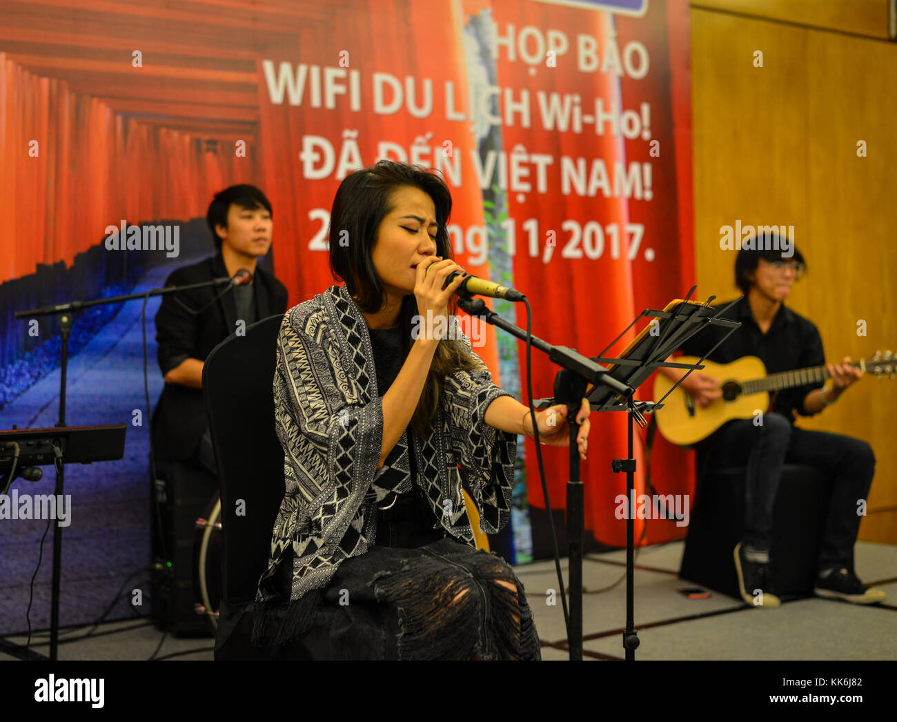 Saigon, Vietnam - Nov 20, 2017. A singer with microphone and rock and ...