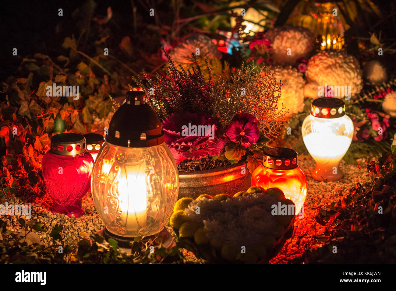 Burning candles on cemetery at night Stock Photo - Alamy