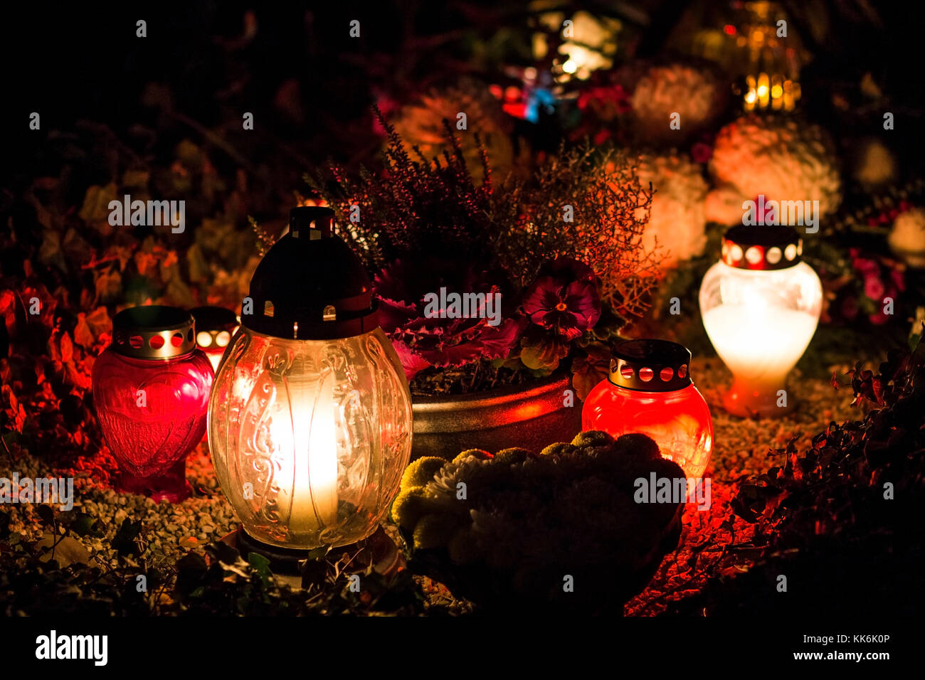 Burning candles on cemetery at night Stock Photo - Alamy