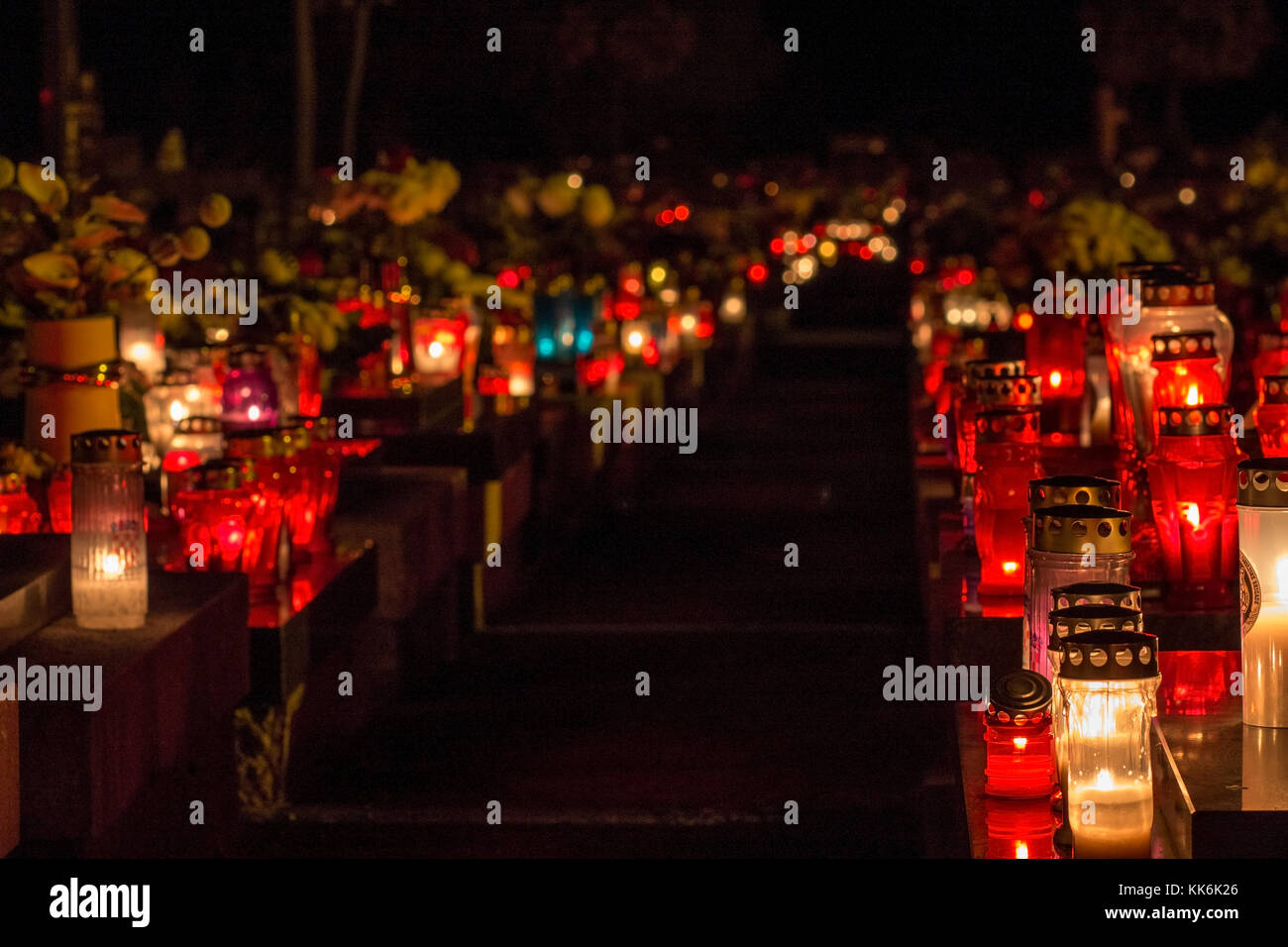 Burning candles on cemetery at night Stock Photo - Alamy