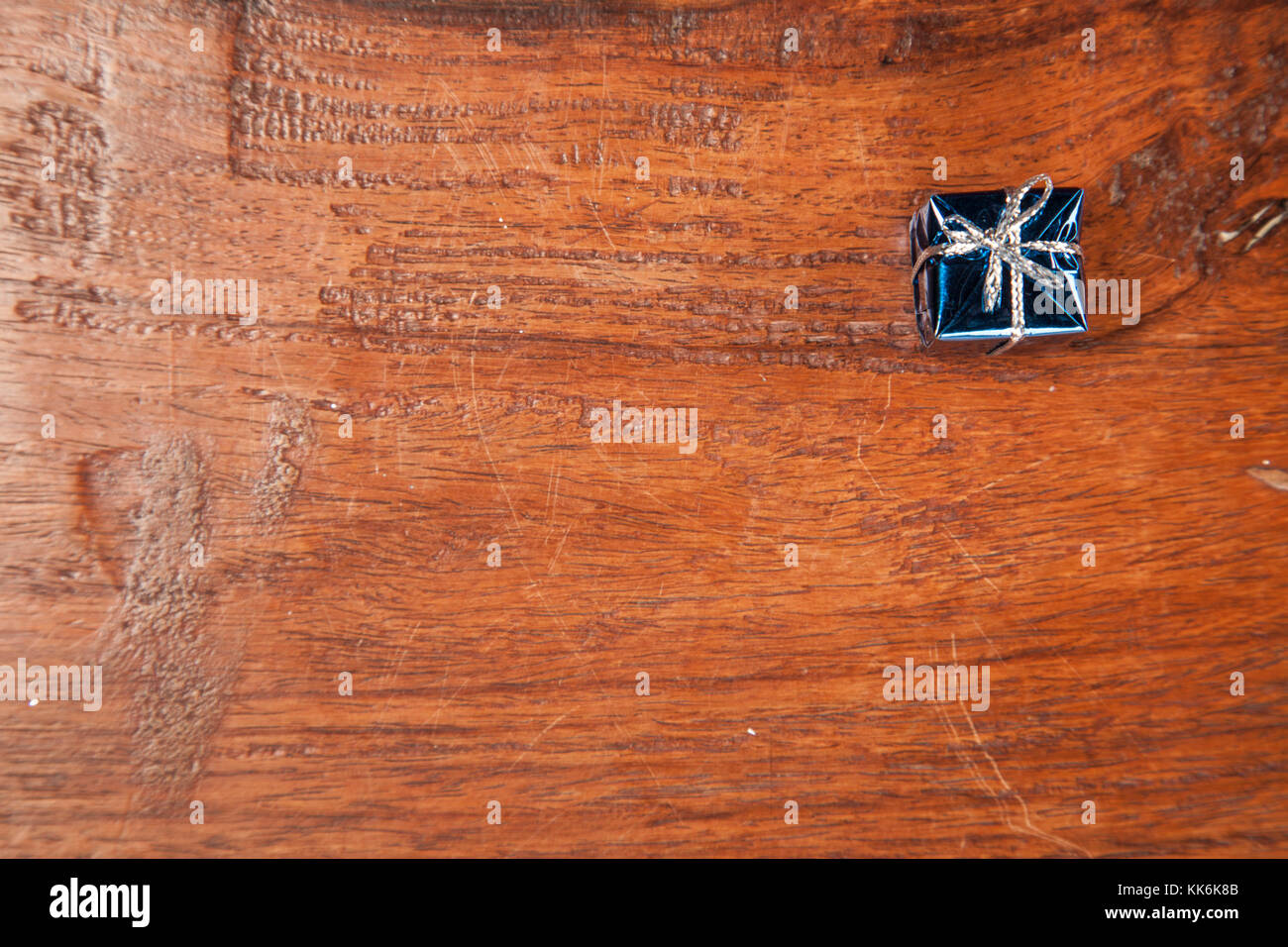little gift in the corner of the table, copy space Stock Photo - Alamy