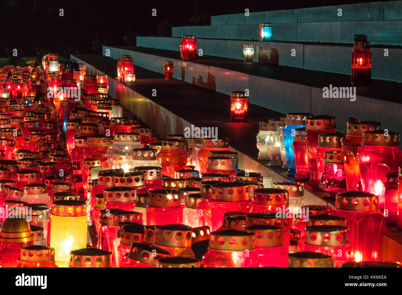 Burning candles on cemetery at night Stock Photo - Alamy