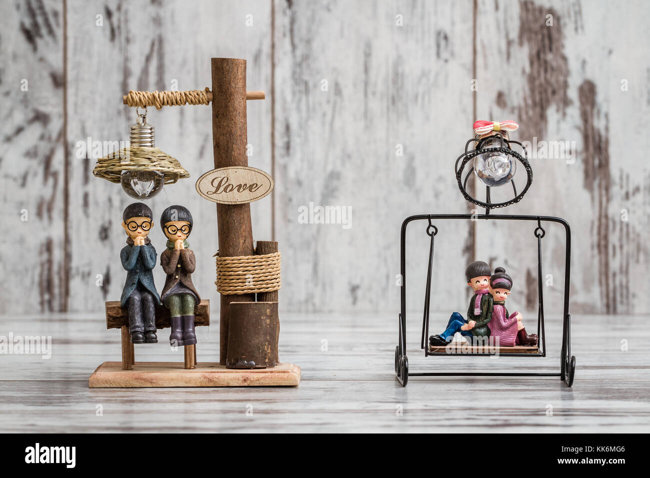 Cute cuple trinkets on white wooden background Stock Photo - Alamy