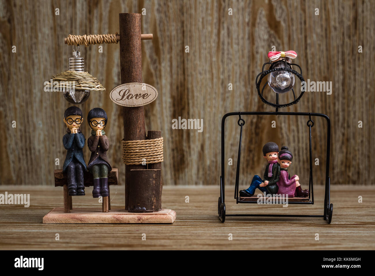 Cute cuple trinkets on brown wooden background Stock Photo - Alamy