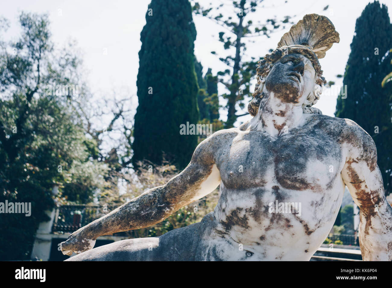 Statue Of Achilles Trying To Remove The Arrow From His Hill Stock Photo statue-of-achilles-trying-to-remove-the-arrow-from-his-hill-stock-photo