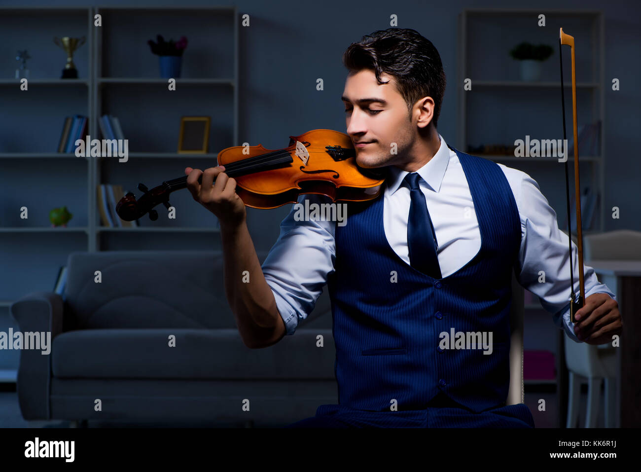 Young musician man practicing playing violin at home Stock Photo - Alamy