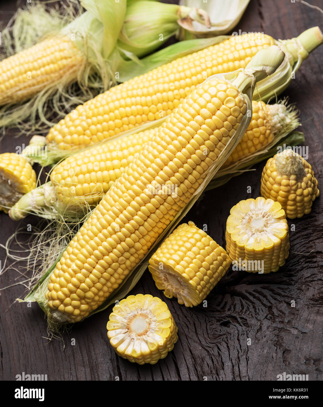 Ear of maize or corn on the dark wooden background Stock Photo - Alamy