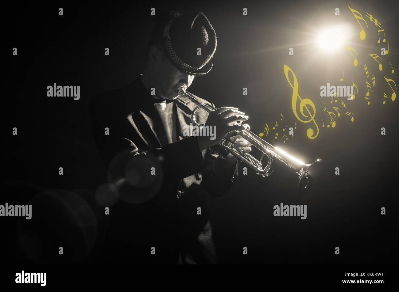 Musician playing the Trumpet with spot light and len flare with music ...