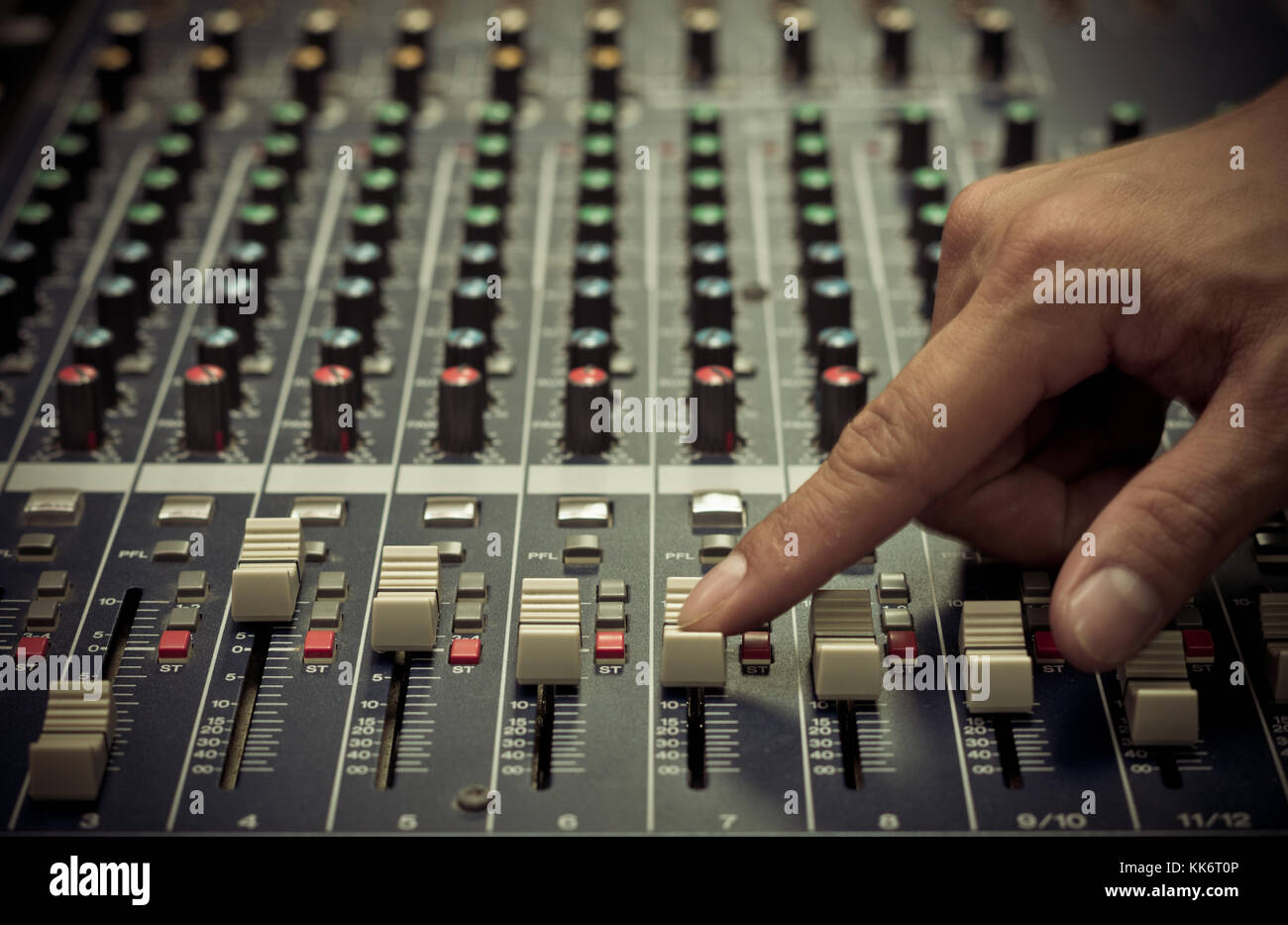 Closeup Hand adjusting audio mixer, music instrument concept Stock ...