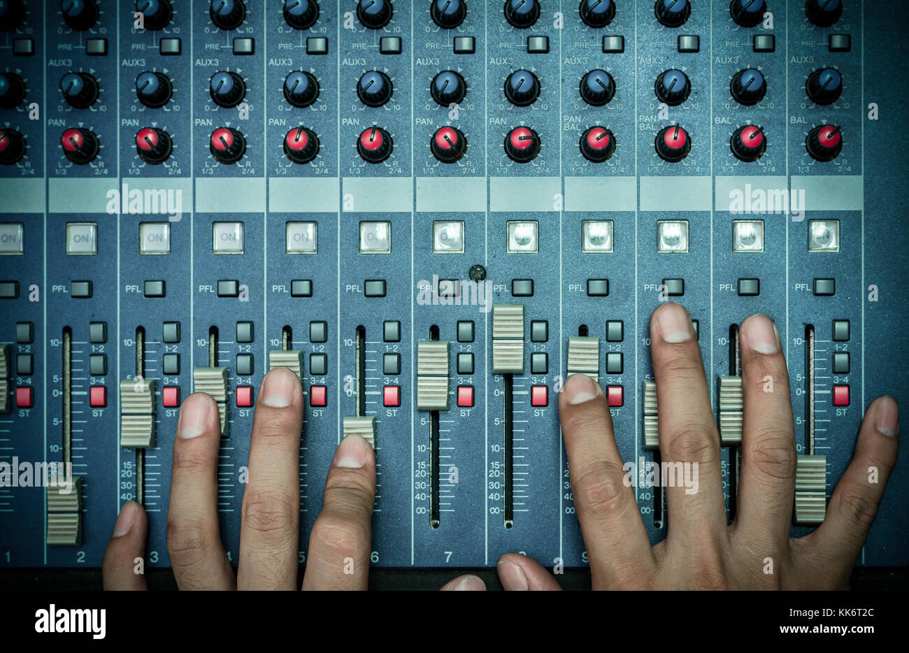 Top view of Hands adjusting audio mixer, music instrument concept Stock ...