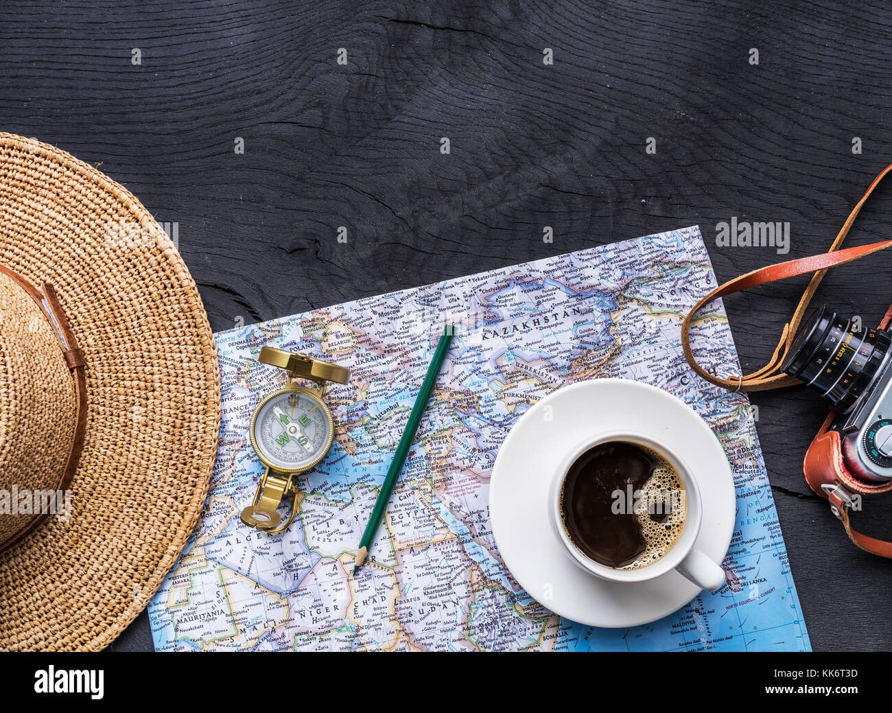 Planning new travel destinations on the world map. Top view Stock Photo ...