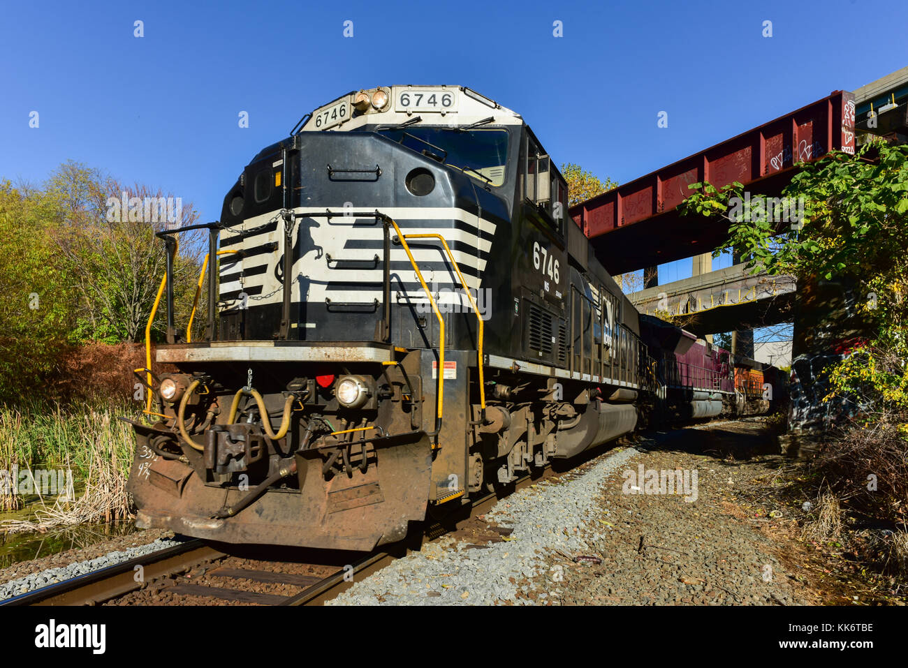 Freight train passing under bridge in Jersey City, New Jersey Stock ...