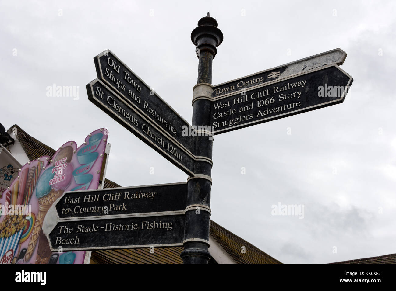 A street sign post indicating towards tourist attractions at Hastings ...