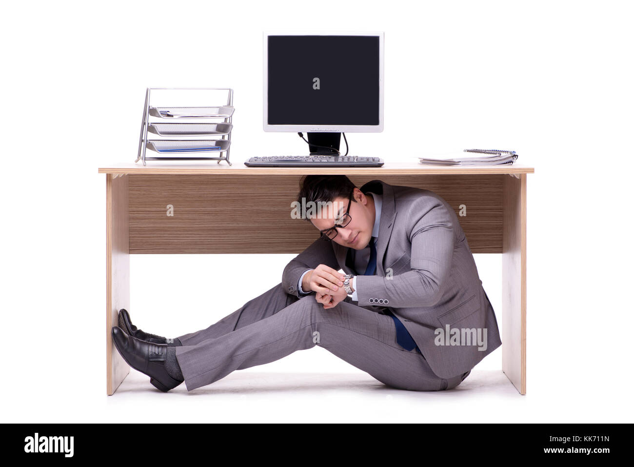 Businessman hiding in the ofice Stock Photo - Alamy