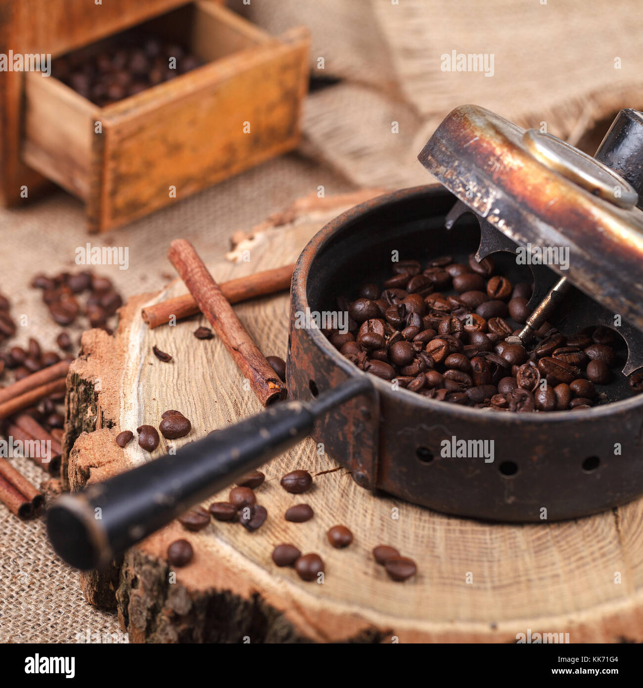 The device for roasting coffee beans, an old hand grinder. Smoky roast ...