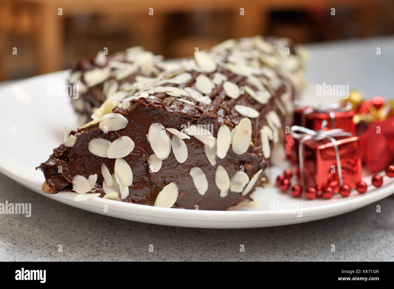 Christmas log with decorations Stock Photo - Alamy