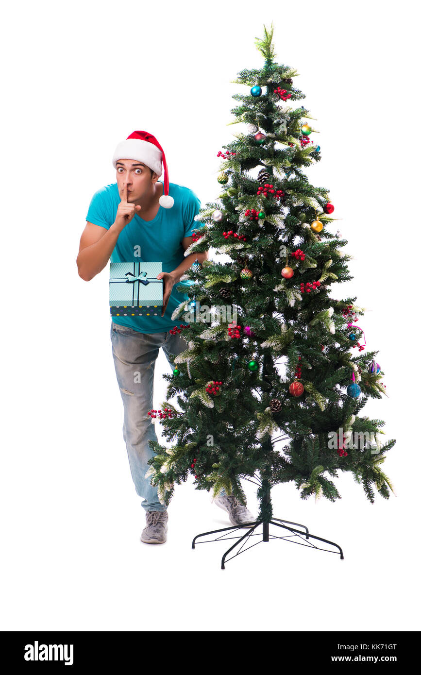 Young man decorating christmas tree isolated on white Stock Photo - Alamy