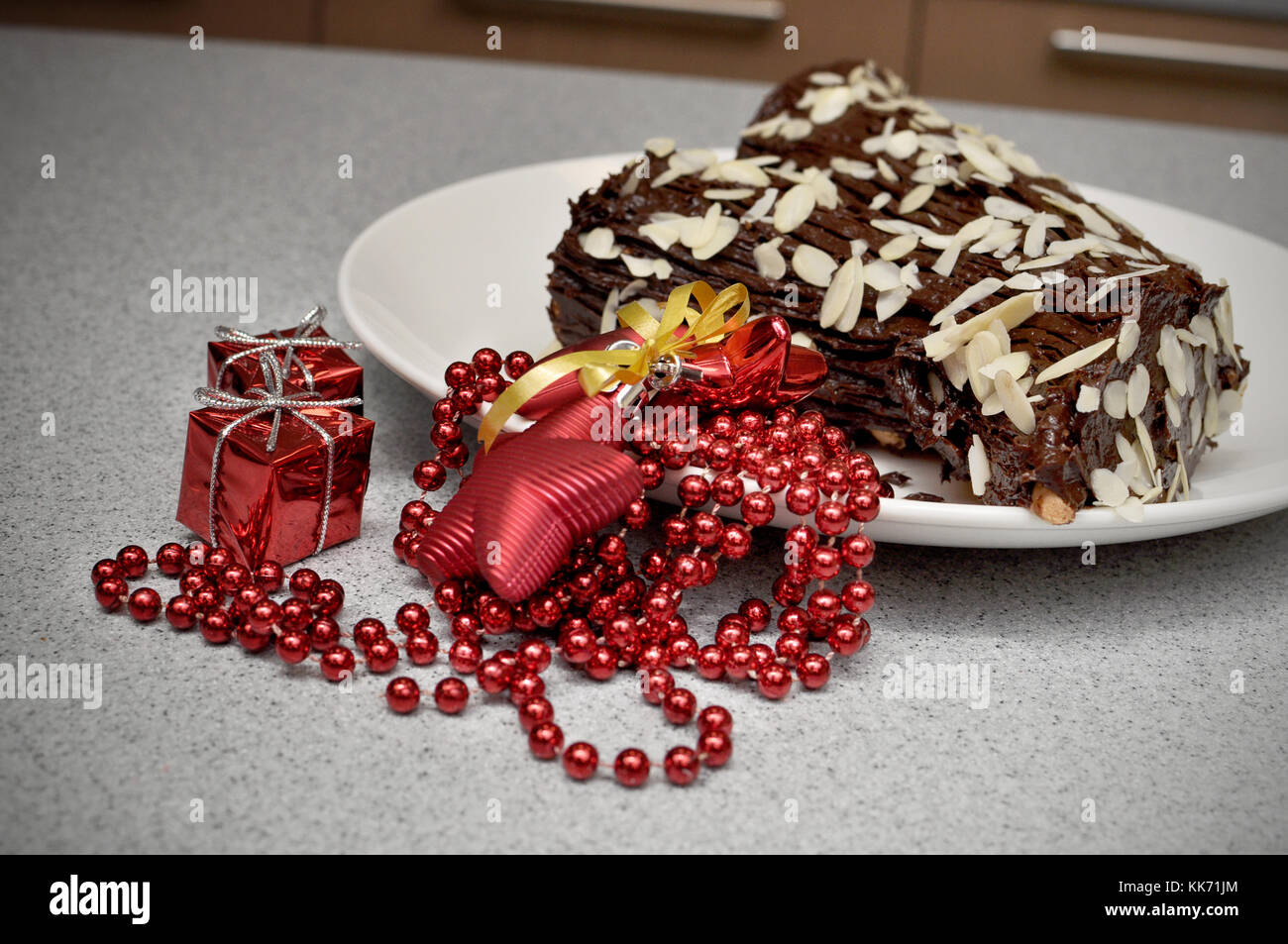 Christmas log with decorations Stock Photo - Alamy