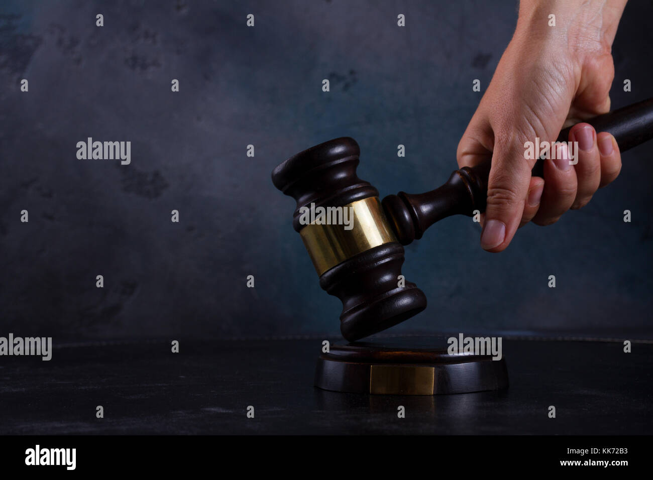 Hand holding law gavel Stock Photo - Alamy