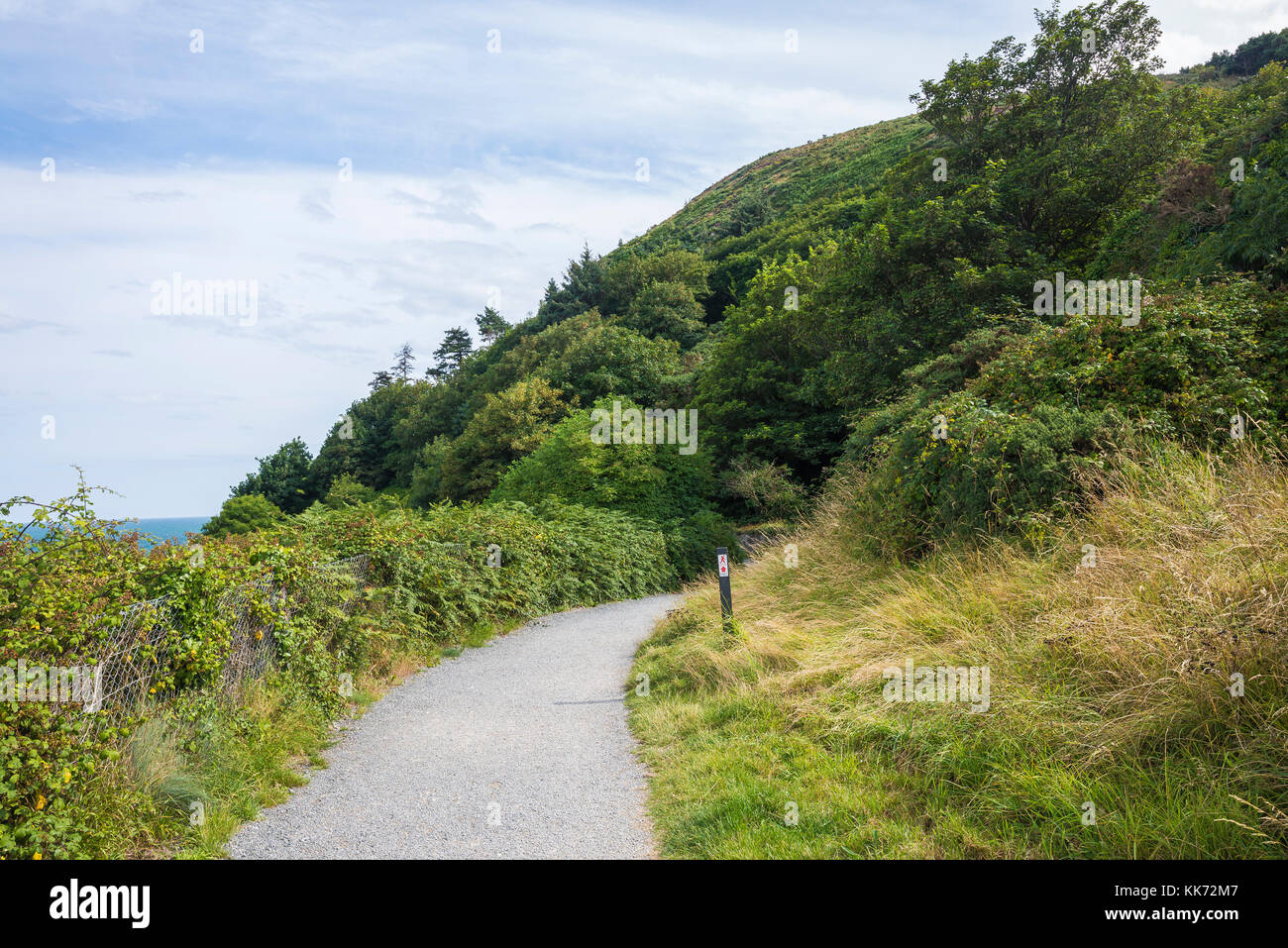 Stone rocks mountain hiking path at Irish seacoast. Bray, Greystone ...