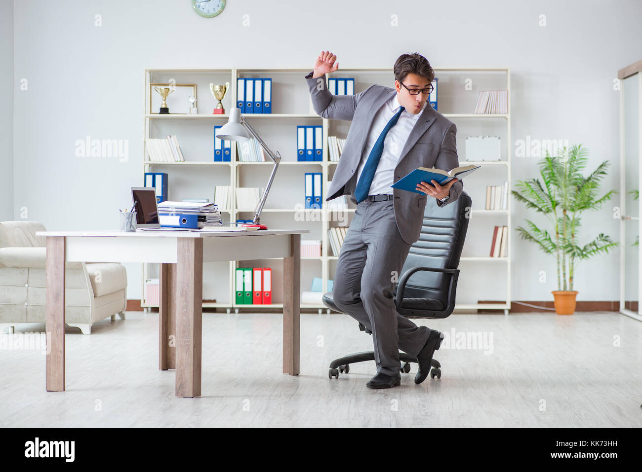 Businessman having fun taking a break in the office at work Stock Photo ...