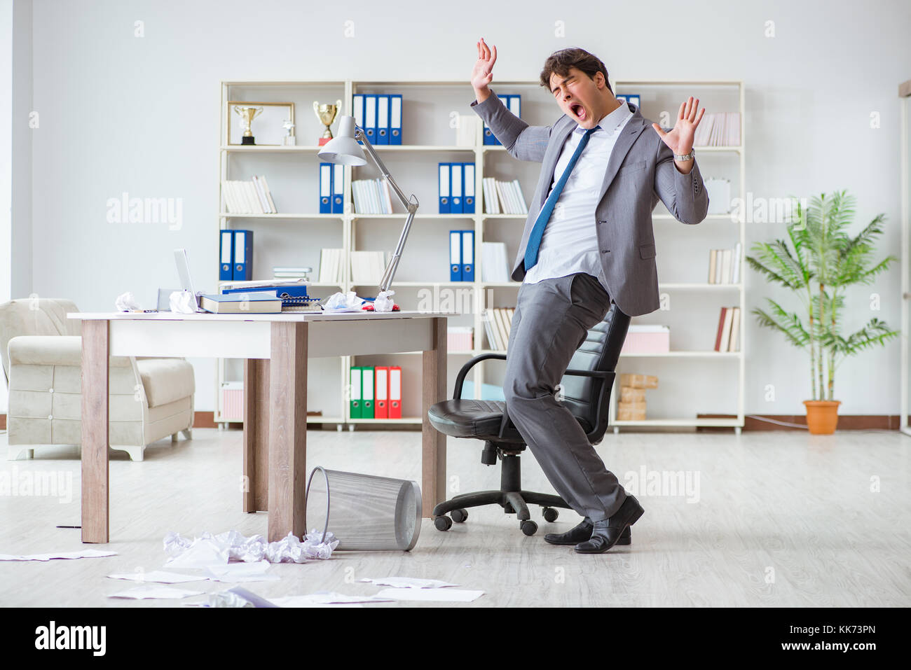 Businessman having fun taking a break in the office at work Stock Photo ...